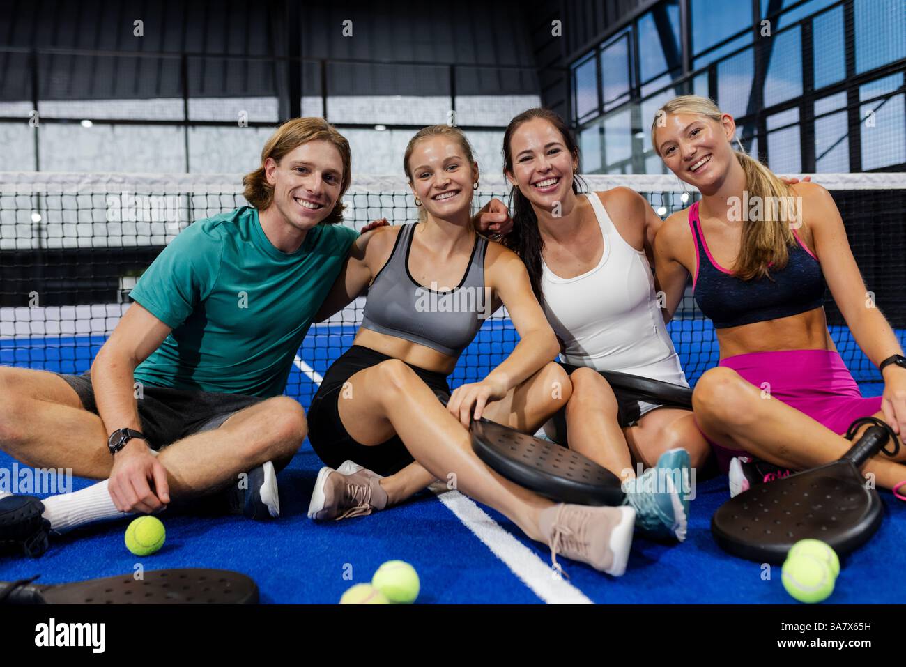 Group friends sitting on padel hi-res stock photography and images - Alamy