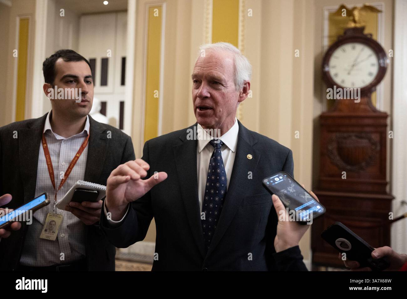 Sen. Ron Johnson (R-Wis.) speaks with reporters on his way to a vote at ...