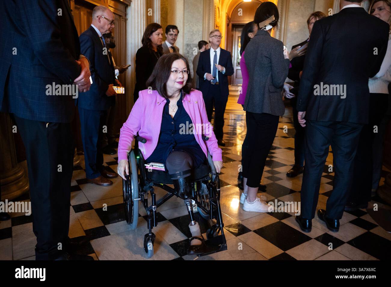 Sen. Tammy Duckworth (D-Ill.) departs a vote at the U.S. Capitol March ...