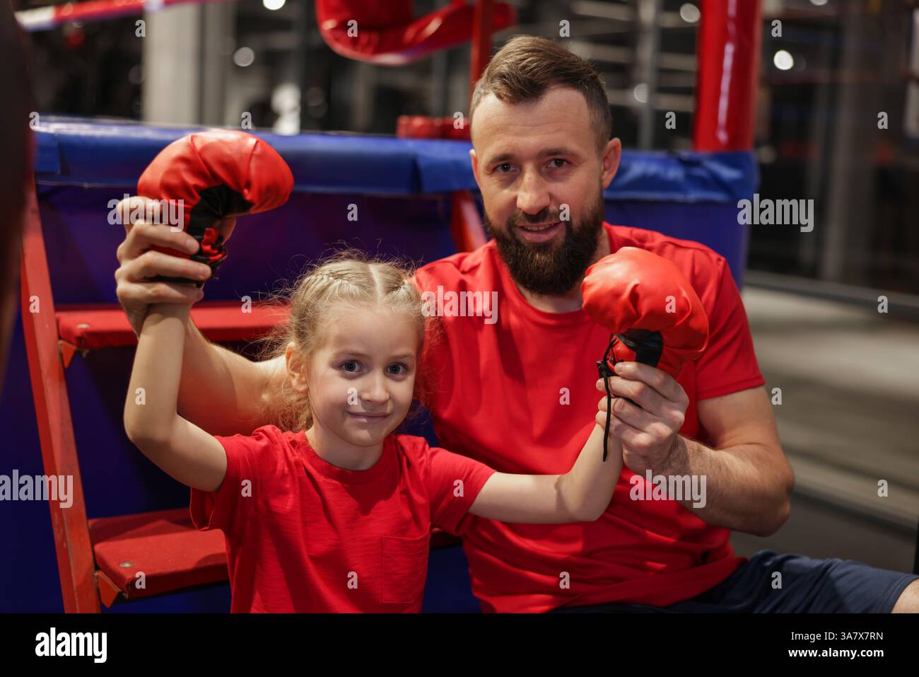 Happy girl with her coach near boxing ring Stock Photo - Alamy