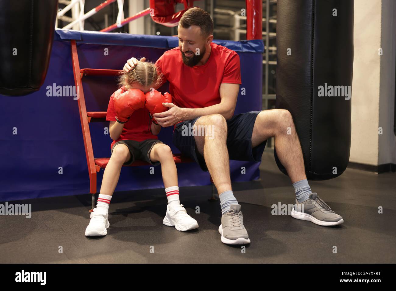 Teacher comforting child hi-res stock photography and images - Alamy