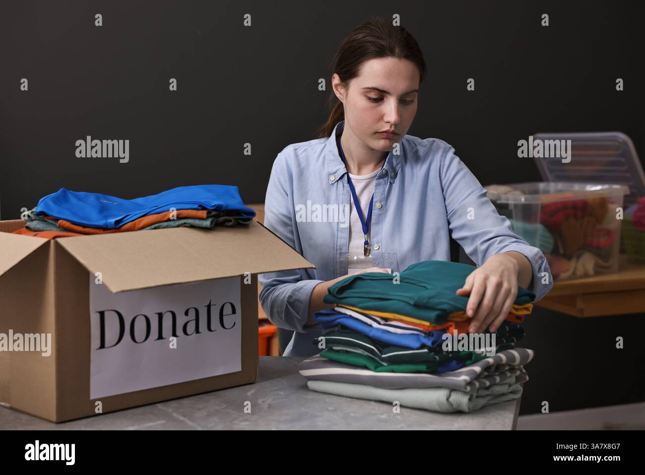 Young volunteer woman sorting hi-res stock photography and images - Alamy