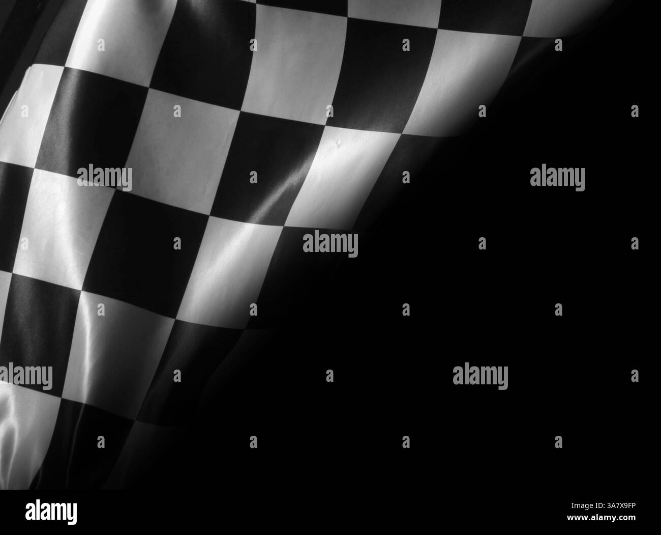 Racing flag with black and white checkers in darkness Stock Photo - Alamy