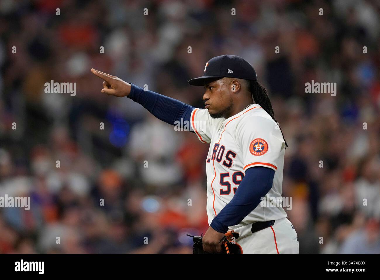 Houston Astros starting pitcher Framber Valdez points to the stands after throwing against the ...