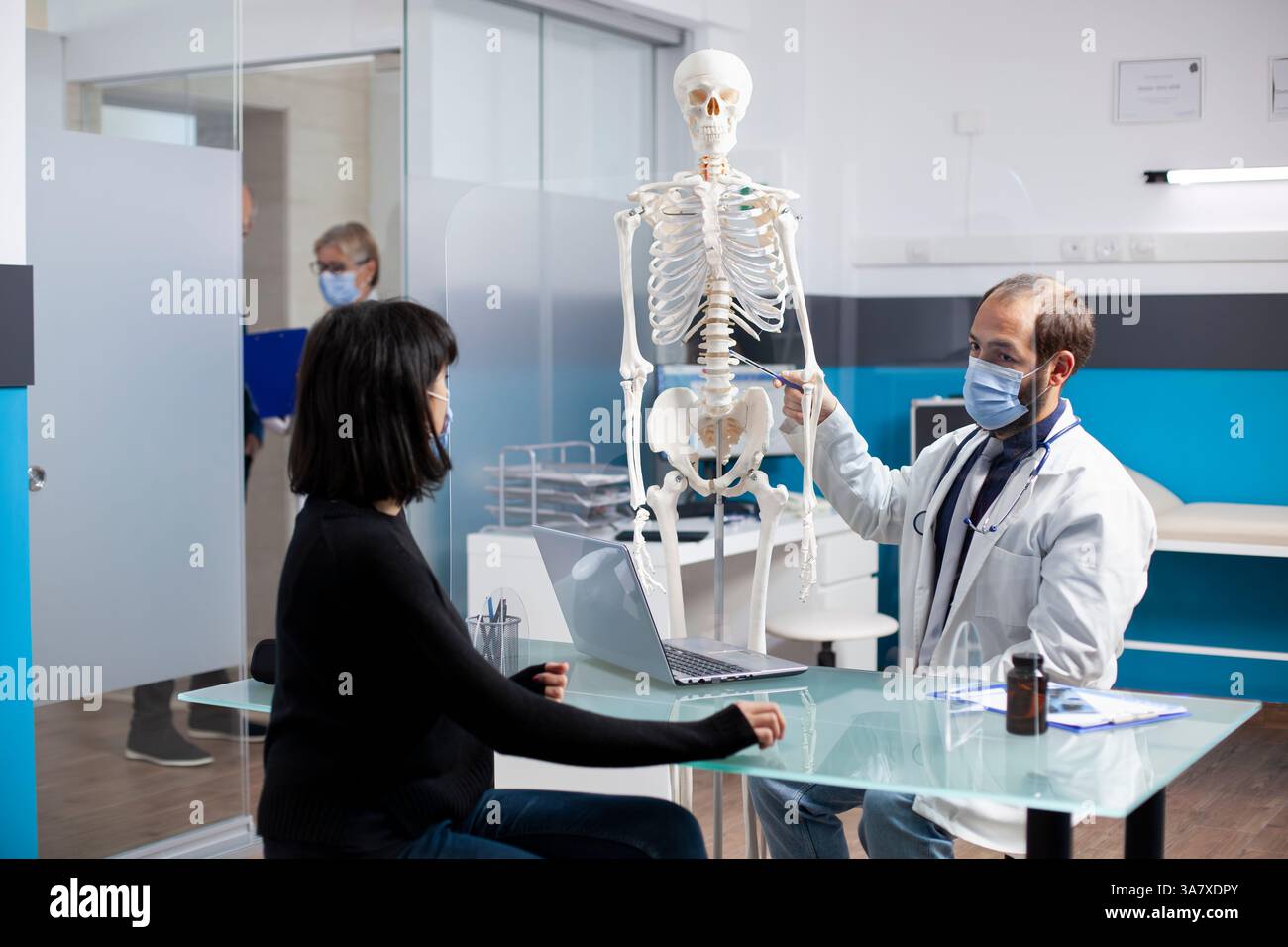Caucasian doctor explains spinal recovery options to female patient in ...
