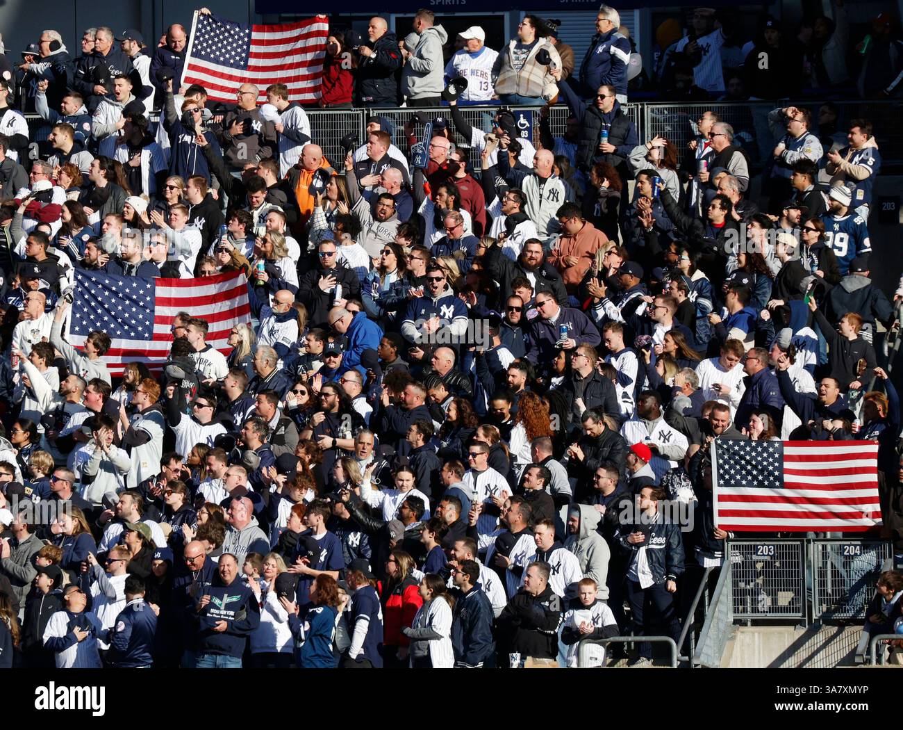 Bronx, United States. 27th Mar, 2025. Fans hold American Flags as God ...