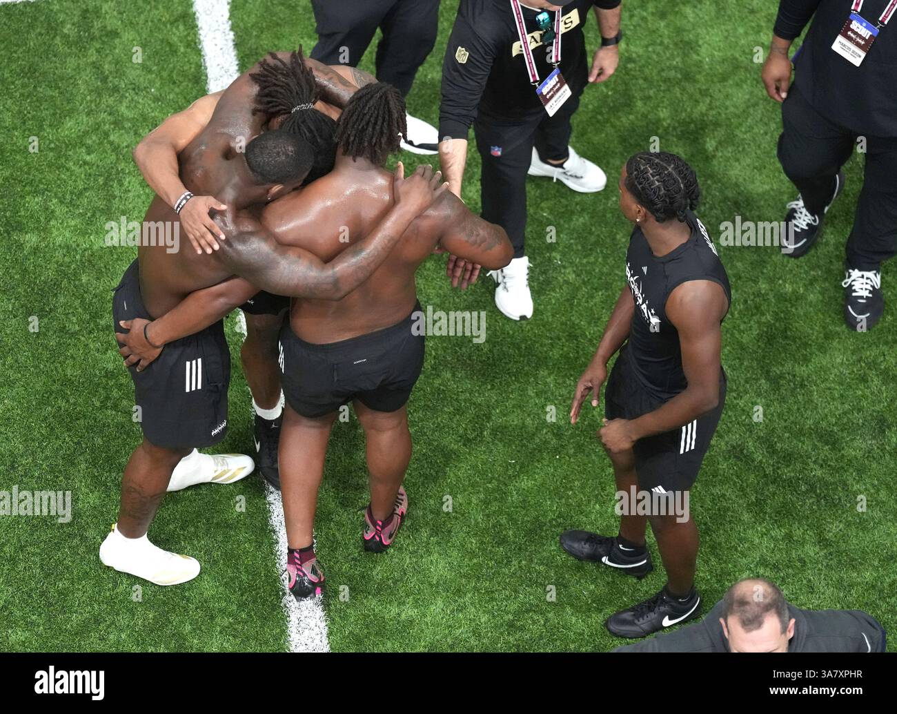 Texas A&M defensive lineman Nic Scourton, left, hugs teammates Rodas ...