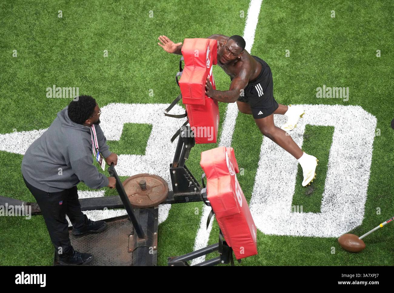 Texas A&M defensive lineman Nic Scourton runs a drill during the school ...