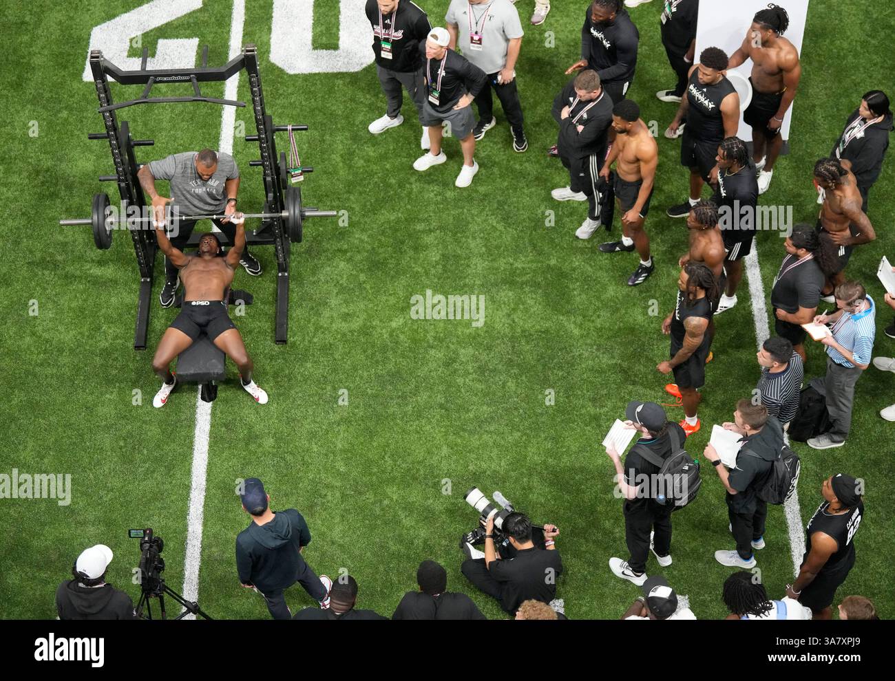 Texas A&M wide receiver Moose Muhammad III bench presses during the ...