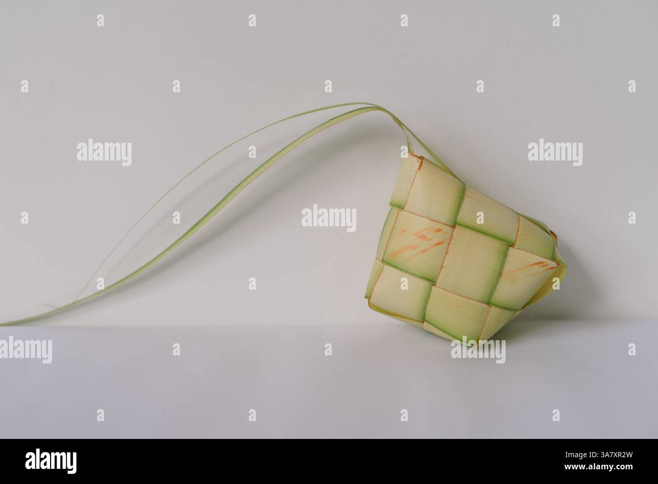 Close-up shot of a ketupat casing, a traditional Indonesian and Malay ...