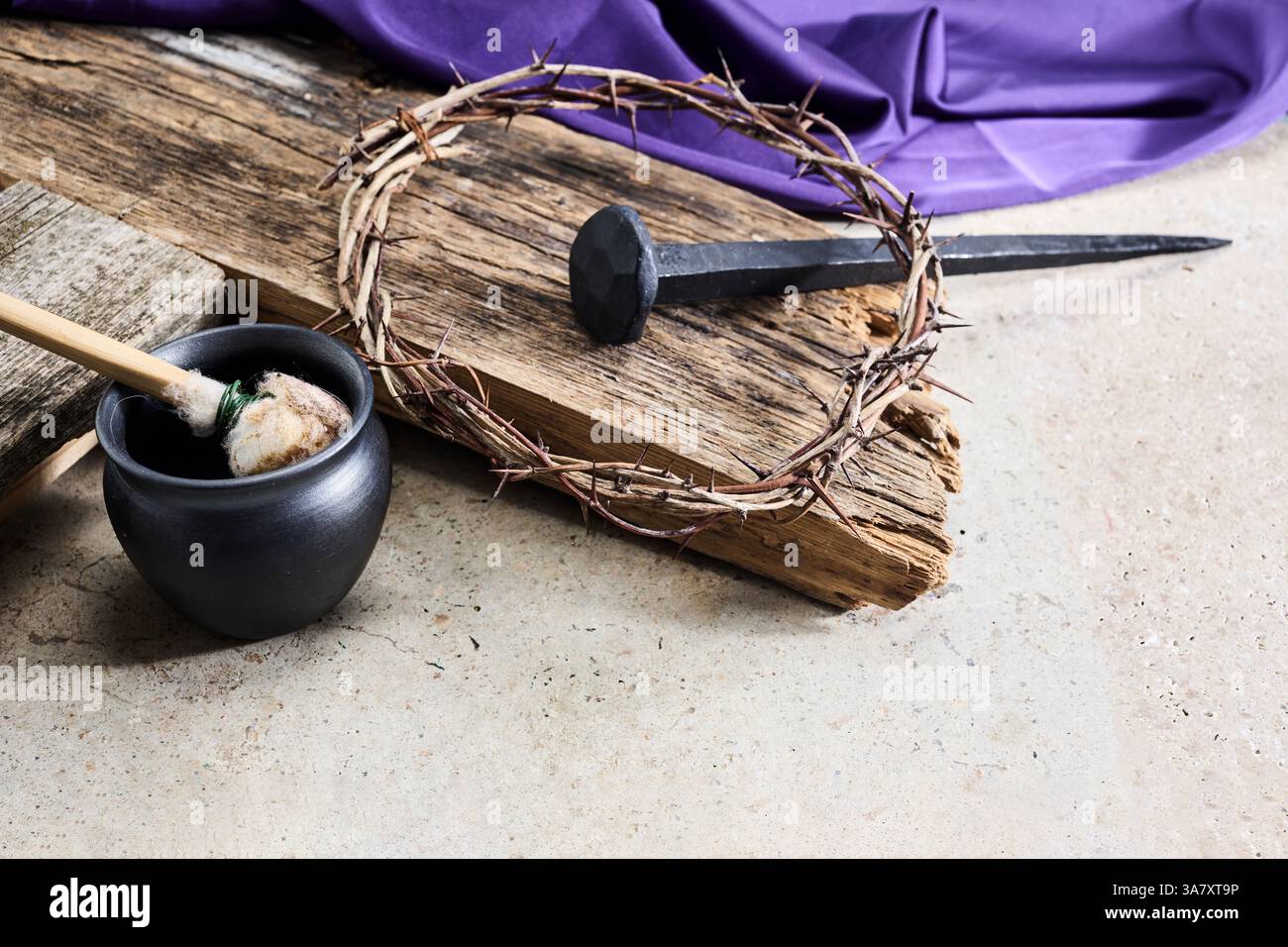 Easter background depicting the crucifixion with a rustic wooden cross, crown of thorns and ...