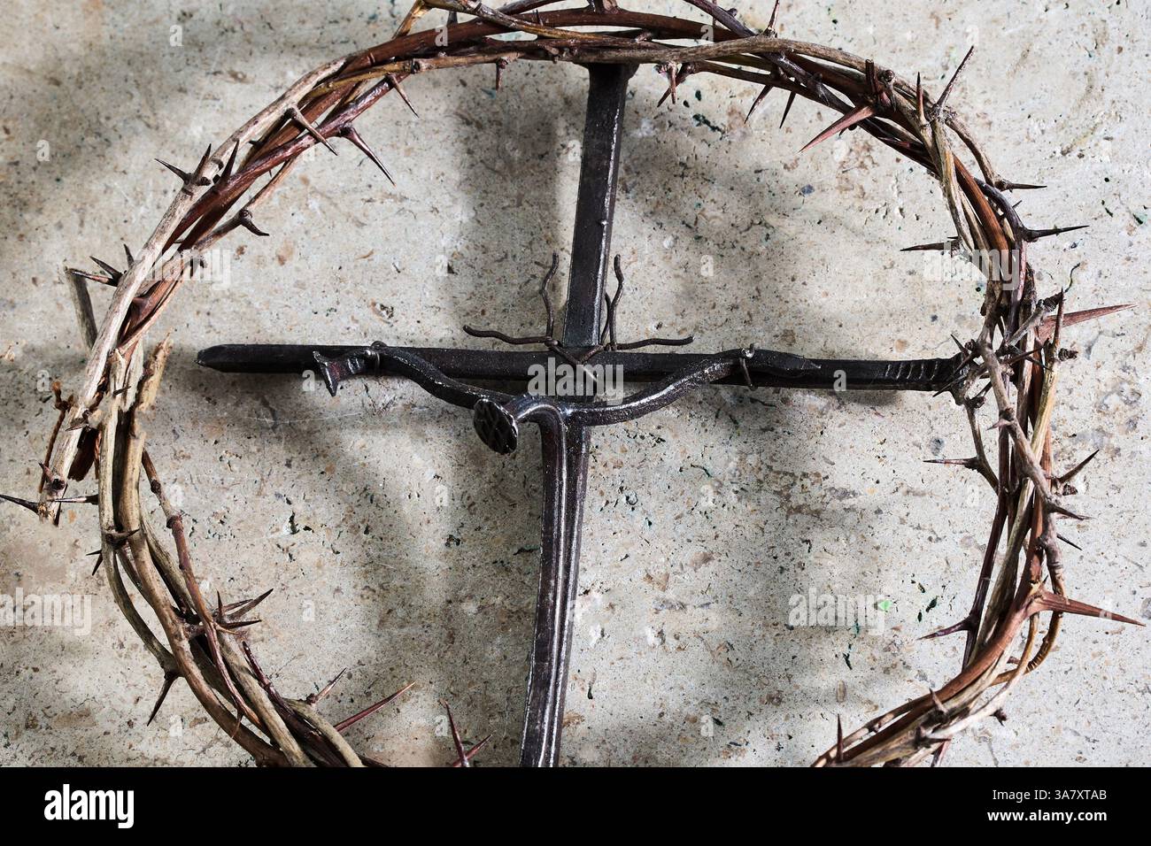 Thorned Cross Symbol. A metal cross encircled by a crown of thorns on a ...