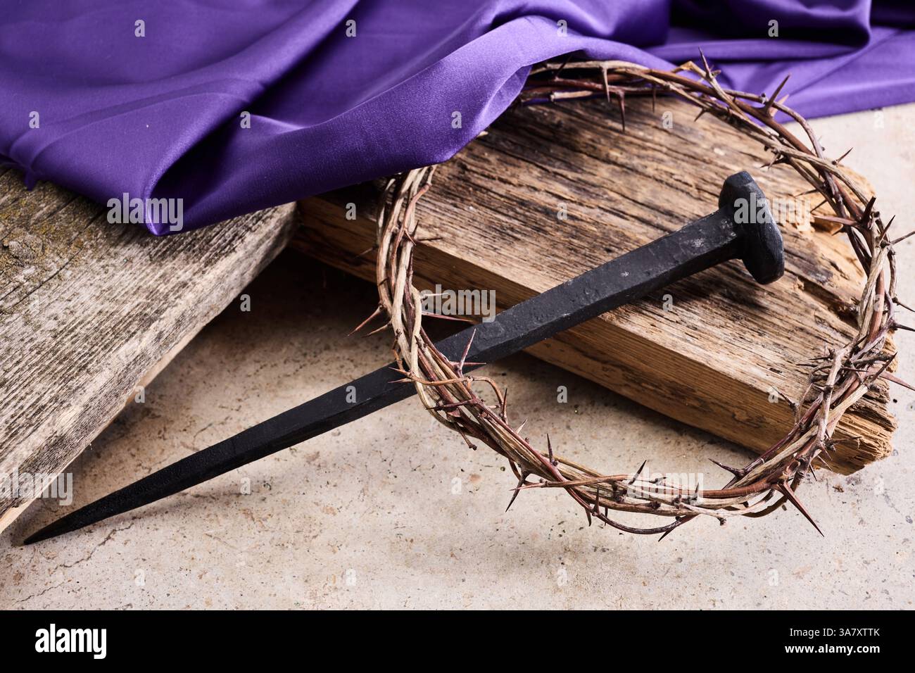 Easter background depicting the crucifixion with a rustic wooden cross, crown of thorns and ...