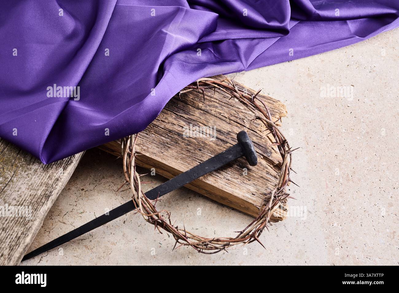 Easter background depicting the crucifixion with a rustic wooden cross, crown of thorns and ...