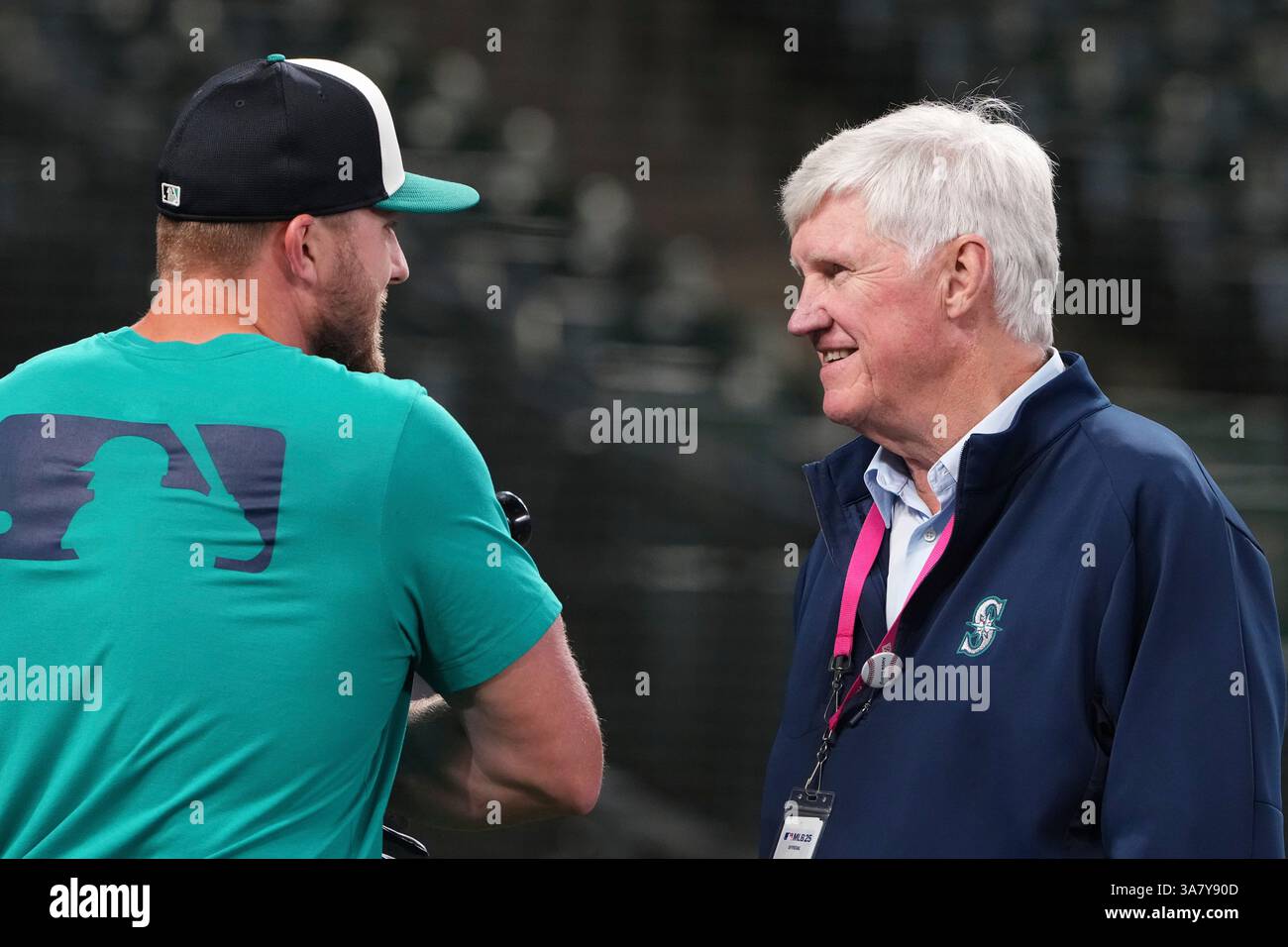 Seattle Mariners owner John Stanton, right, talks with designated ...