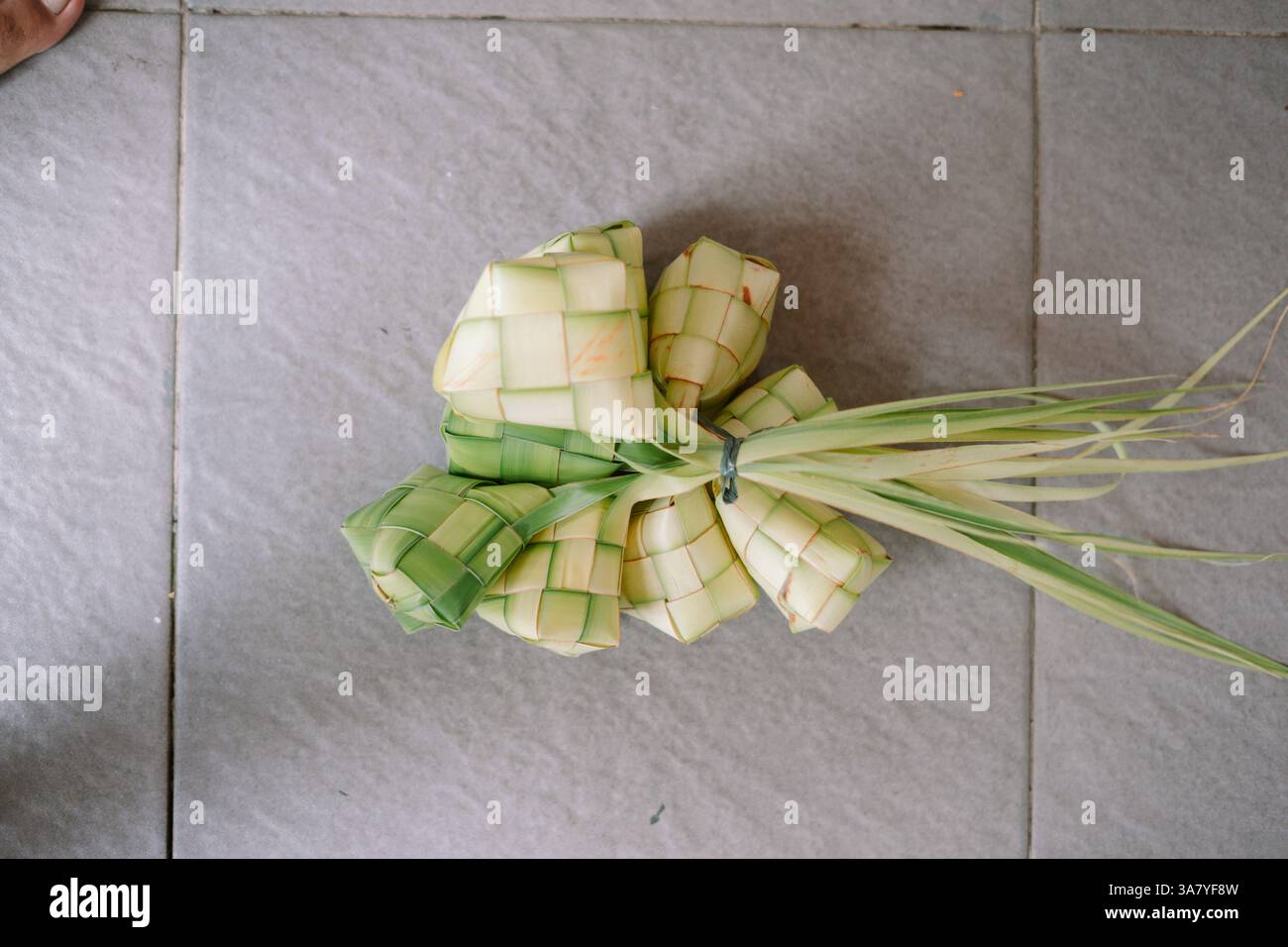 Ketupat, a traditional rice dumpling wrapped in woven palm leaves ...