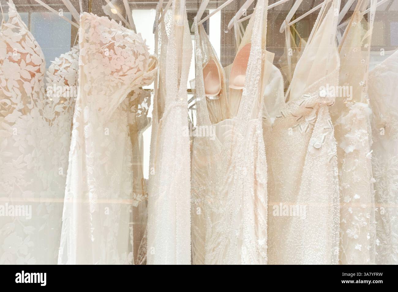 Close-up of lace, sheer fabric and silk chiffon wedding dresses on ...