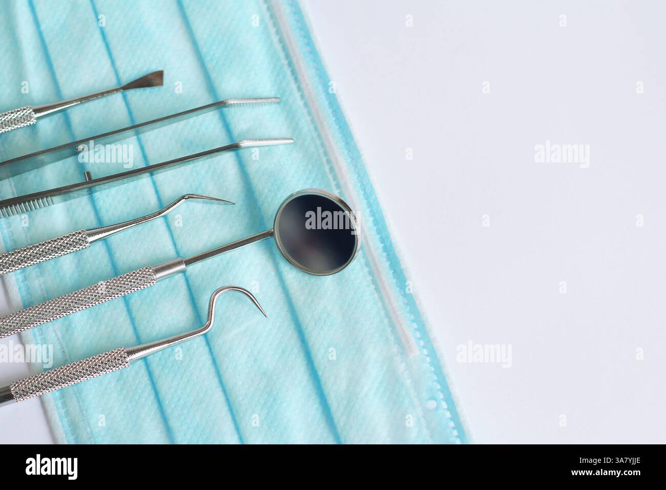 Collection of dental instruments on white background. Dental mirror ...