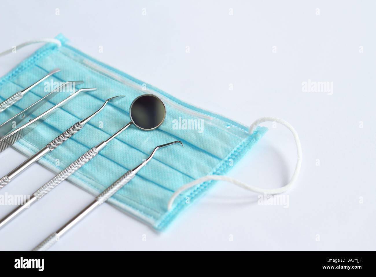 Collection of dental instruments on white background. Dental mirror ...