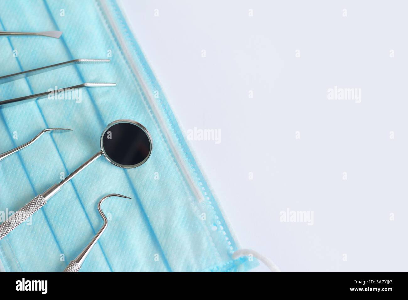 Collection of dental instruments on white background. Dental mirror ...