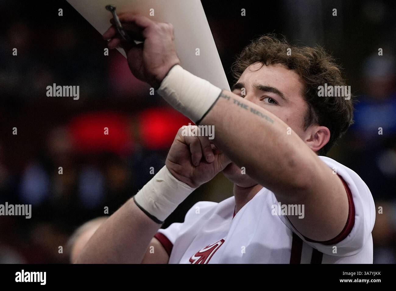 A yell leader from Alabama cheers before the start of a game in the ...