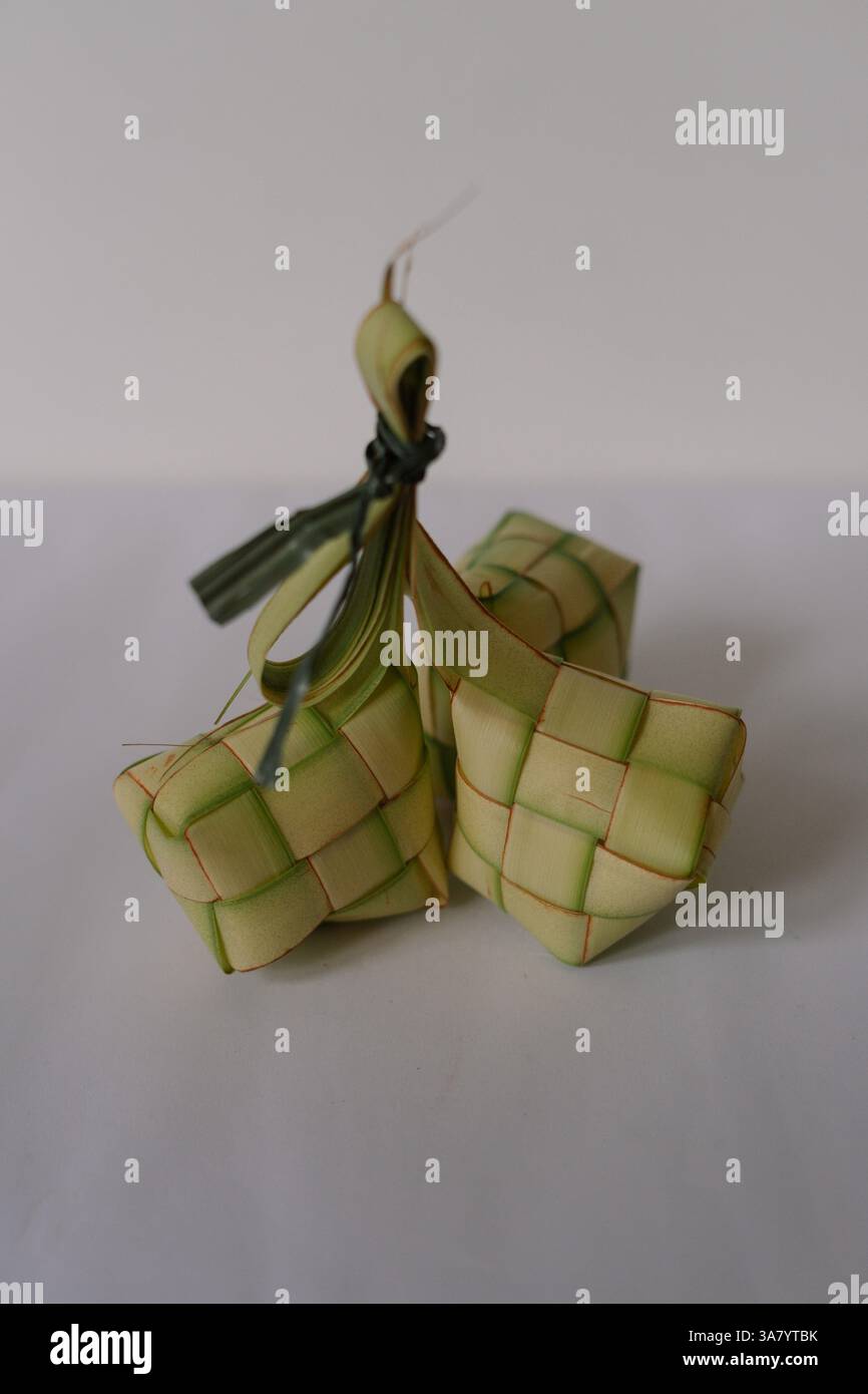 Ketupat is a traditional rice dumpling made of woven coconut leaves. It ...