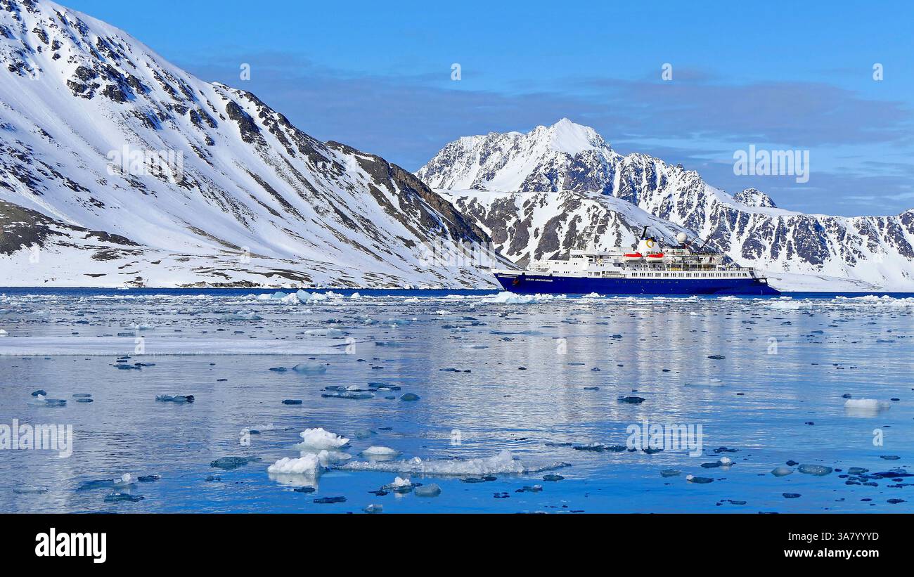 Arctic seascape with expeditionary ship Ocean Adventurer in the waters ...