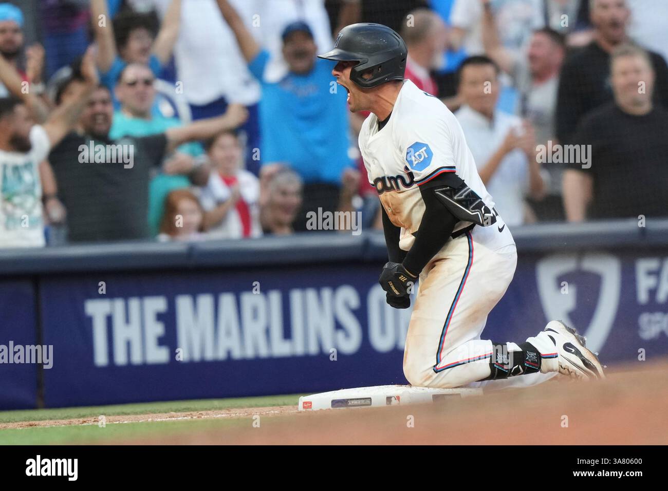 Miami Marlins' Nick Fortes reacts after hitting a triple during the ...