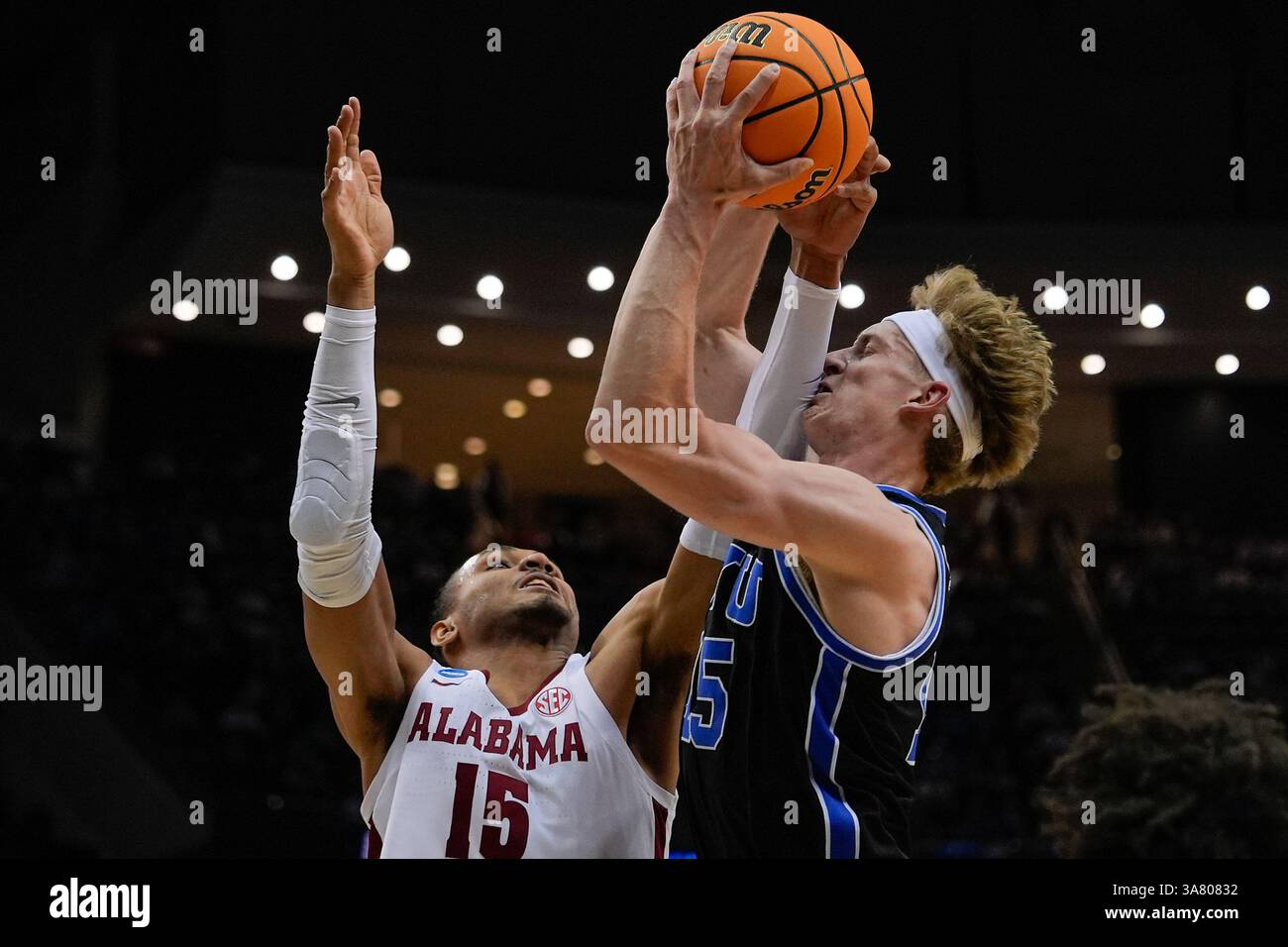 Brigham Young forward Richie Saunders (15) pulls down a rebound against ...