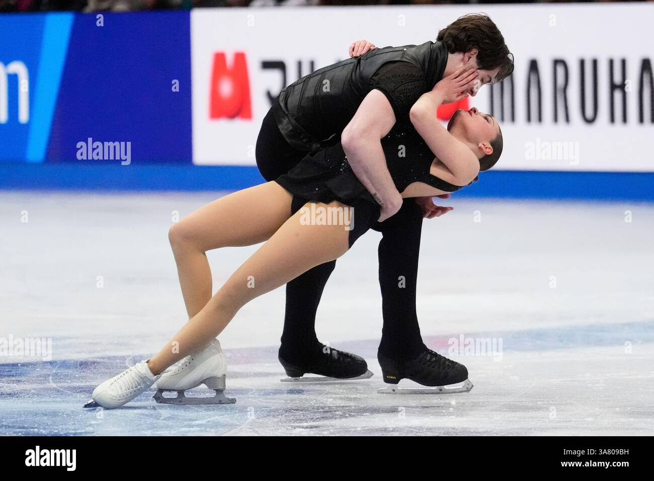 Kelly Ann Laurin and Loucas Ethier, of Canada, perform during the pairs ...