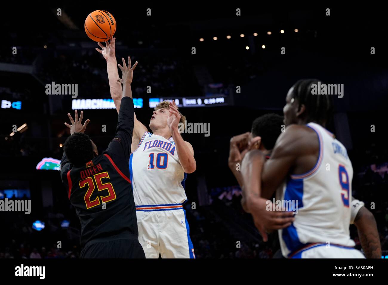 Florida forward Thomas Haugh (10) shoots against Maryland center Derik ...