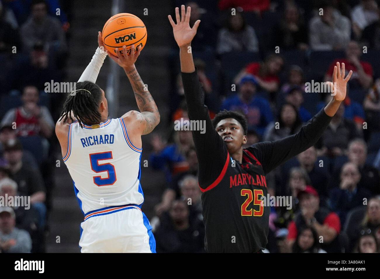 Florida guard Will Richard (5) shoots against Maryland center Derik ...