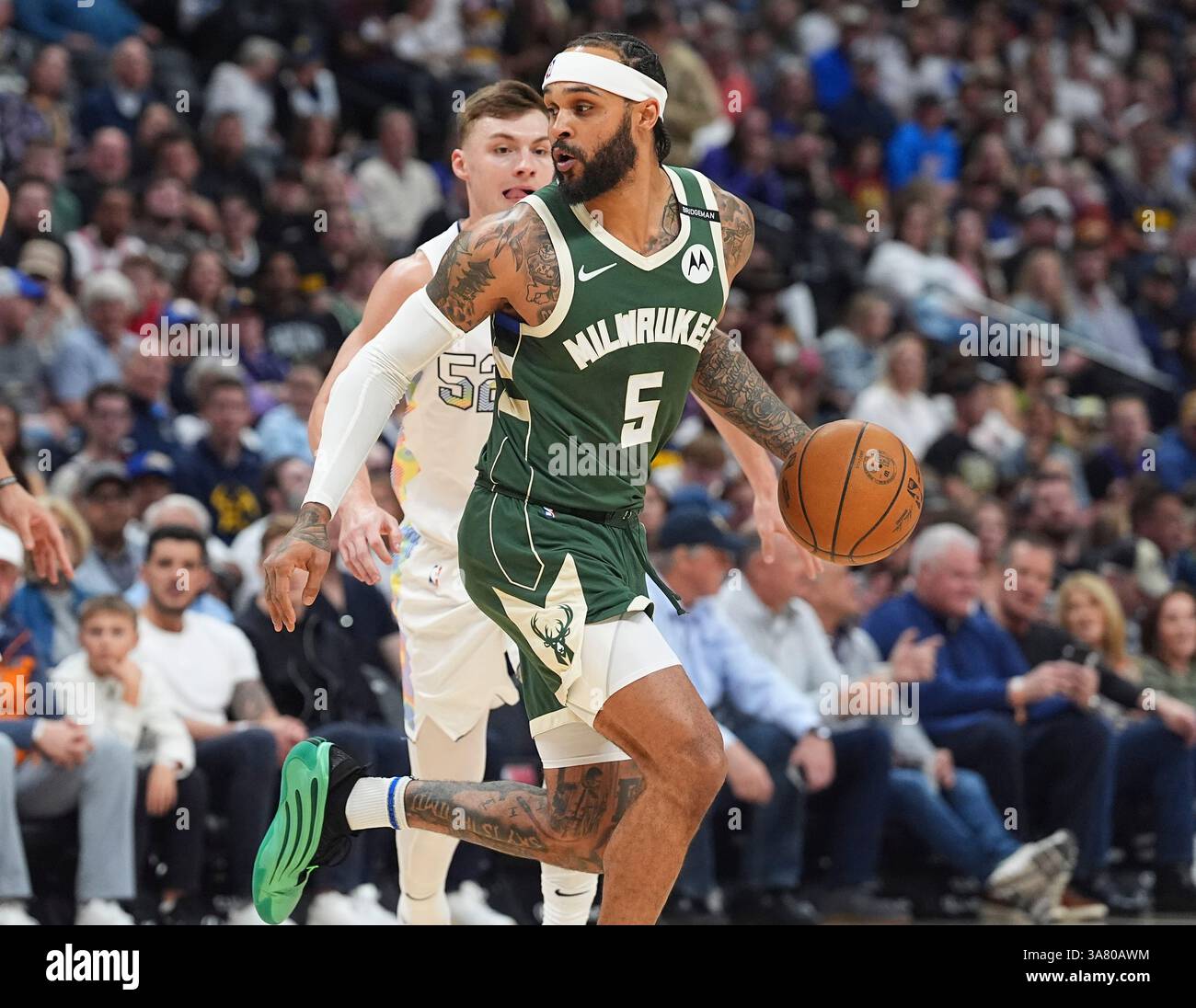 Milwaukee Bucks guard Gary Trent Jr. (5) and Denver Nuggets guard ...