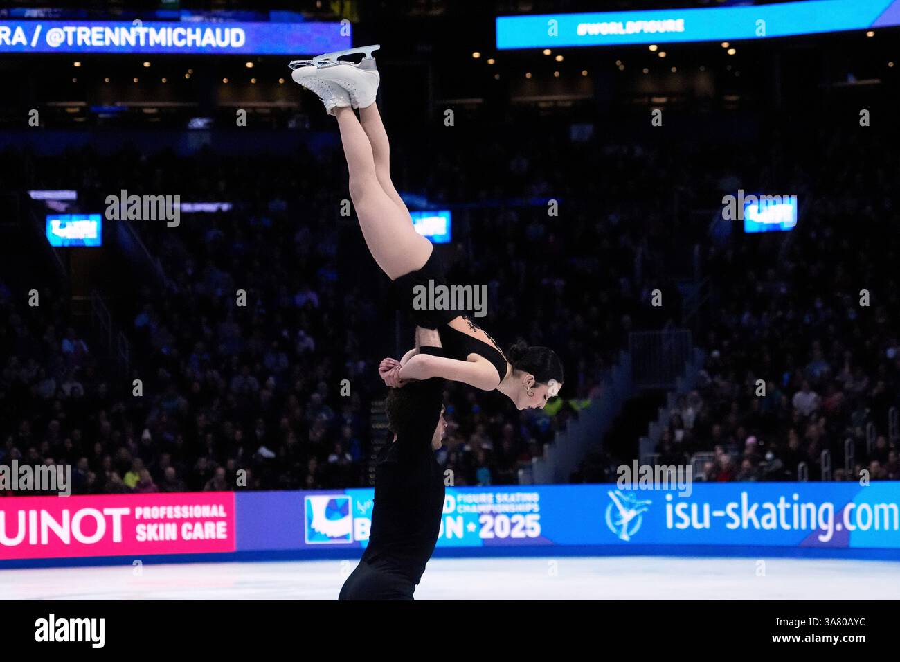 Lia Pereira and Trennt Michaud, of Canada, perform during the pairs ...