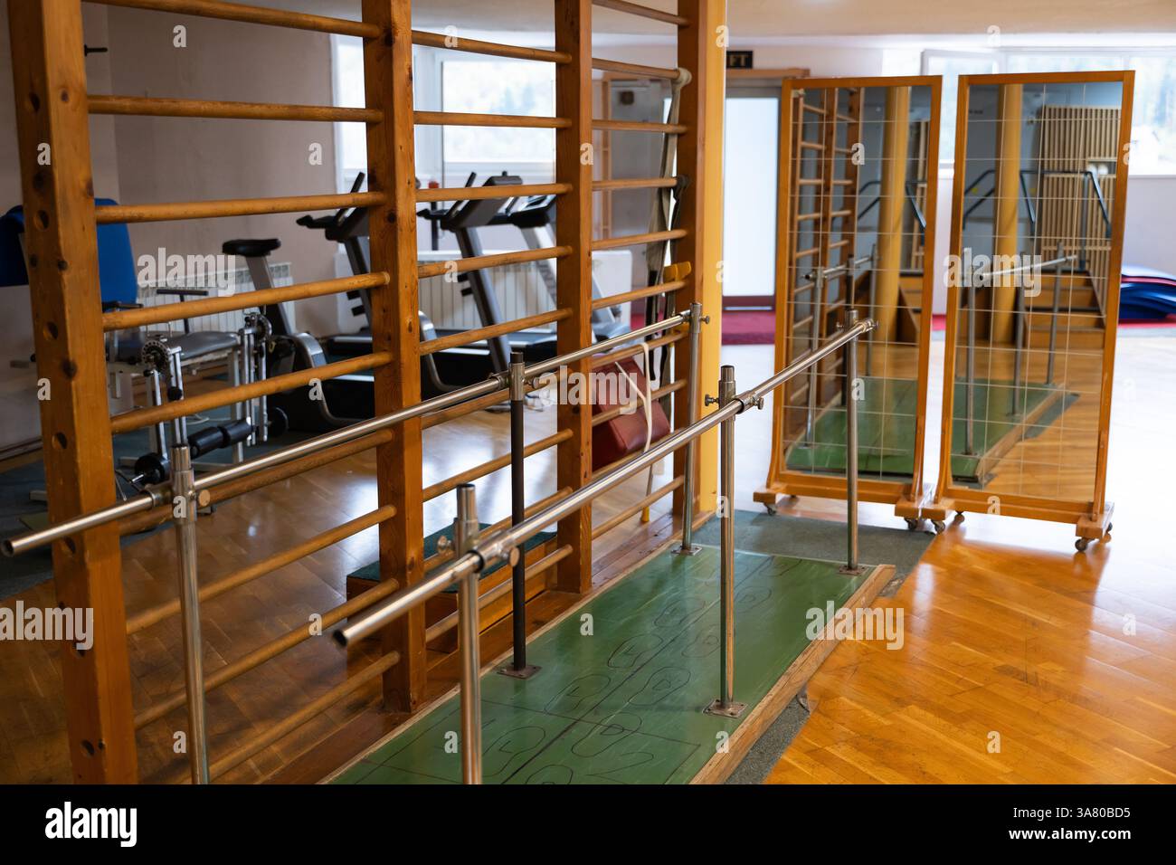 A rehabilitation and physiotherapy gym equipped with parallel bars ...