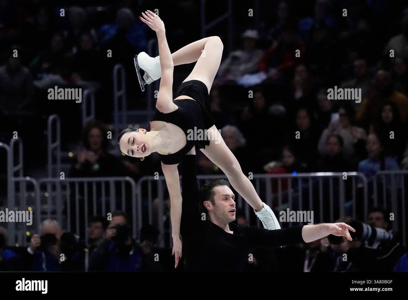 Lia Pereira and Trennt Michaud, of Canada, perform during the pairs ...
