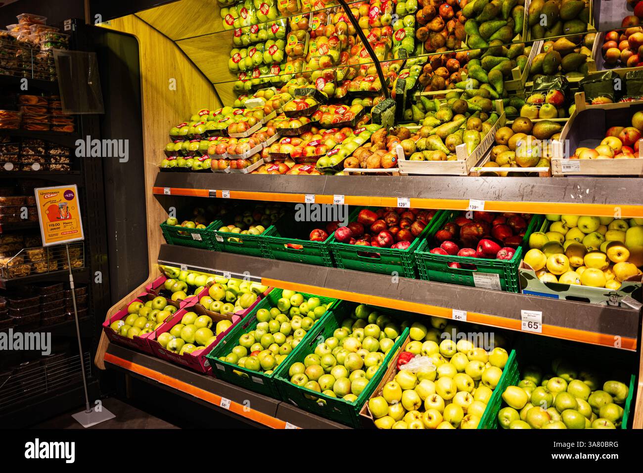 Lviv, Ukraine - March 25, 2025: Shelf display of fresh apples and pears ...