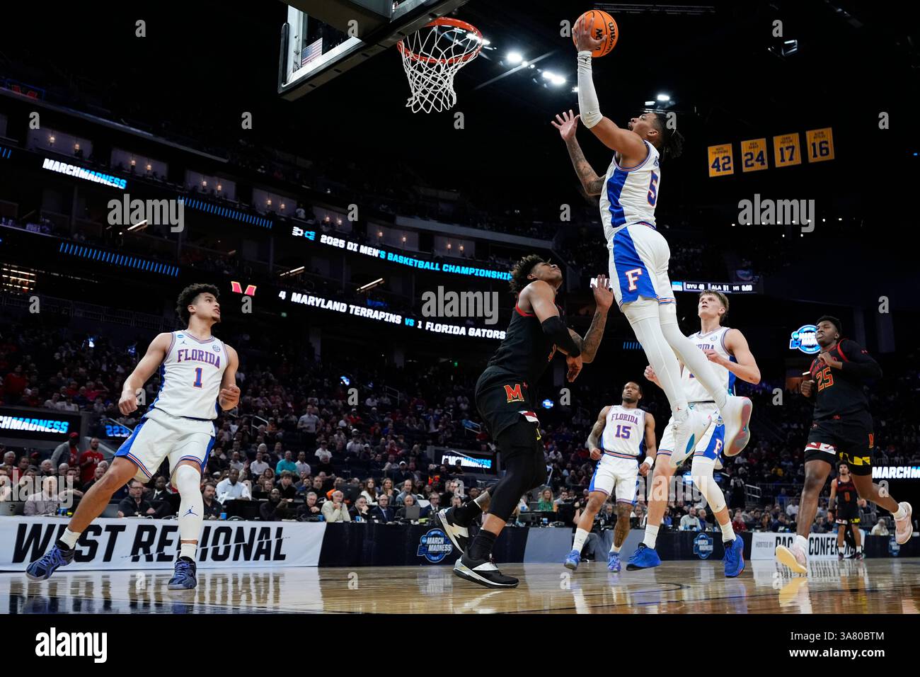 Florida guard Will Richard (5) shoots against Maryland guard DeShawn ...