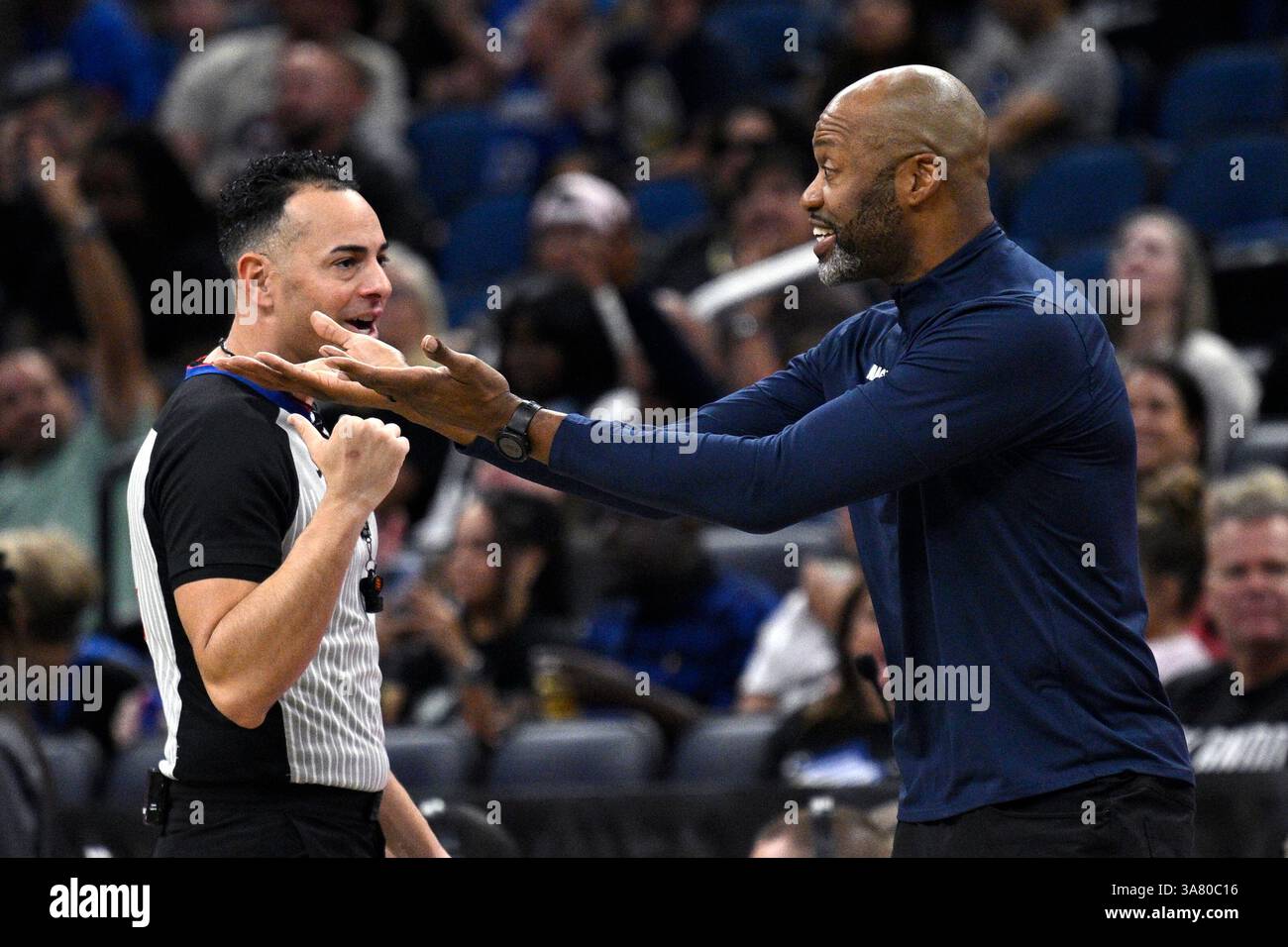 Orlando Magic head coach Jamahl Mosley, right, argues a call with ...