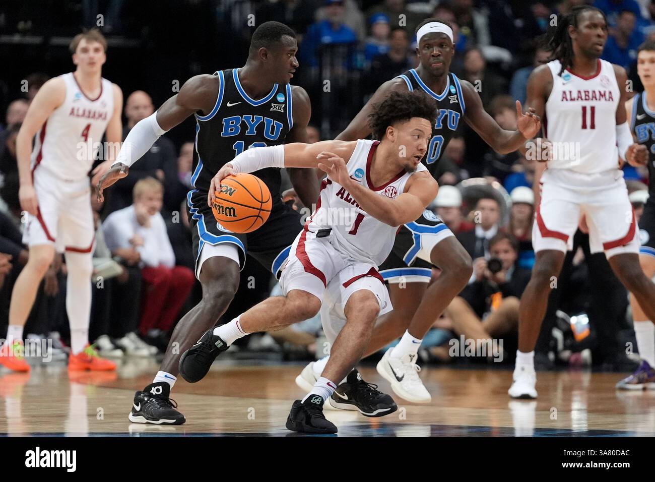 Alabama guard Mark Sears (1) drives against Brigham Young center Keba ...