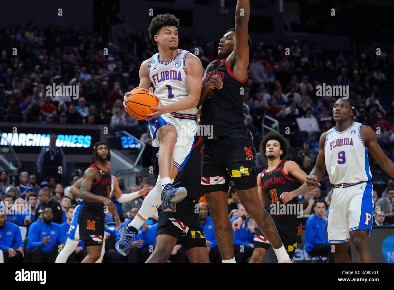 Florida guard Walter Clayton Jr. (1) passes against Maryland forward ...