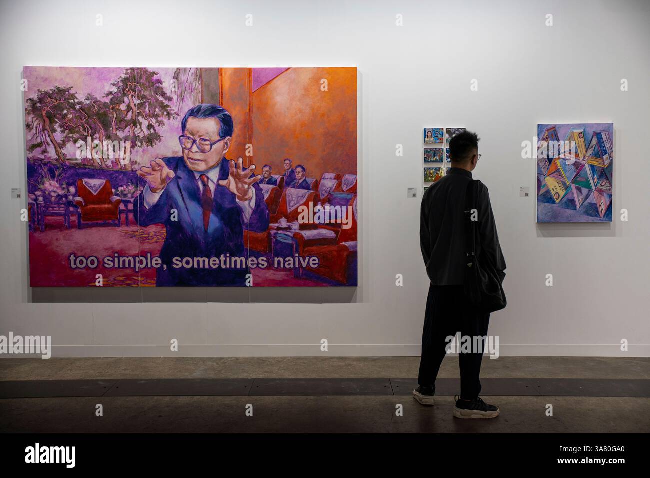 A visitor stands by the artwork "Great Hall of the People on October 27 ...