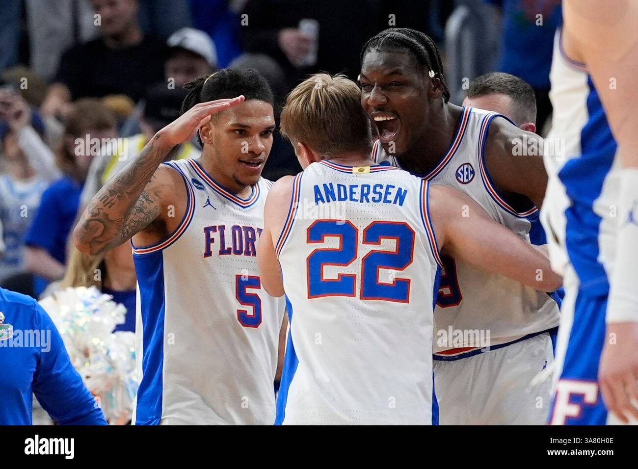 Florida guard Will Richard (5), guard Bennett Andersen (22) and center ...