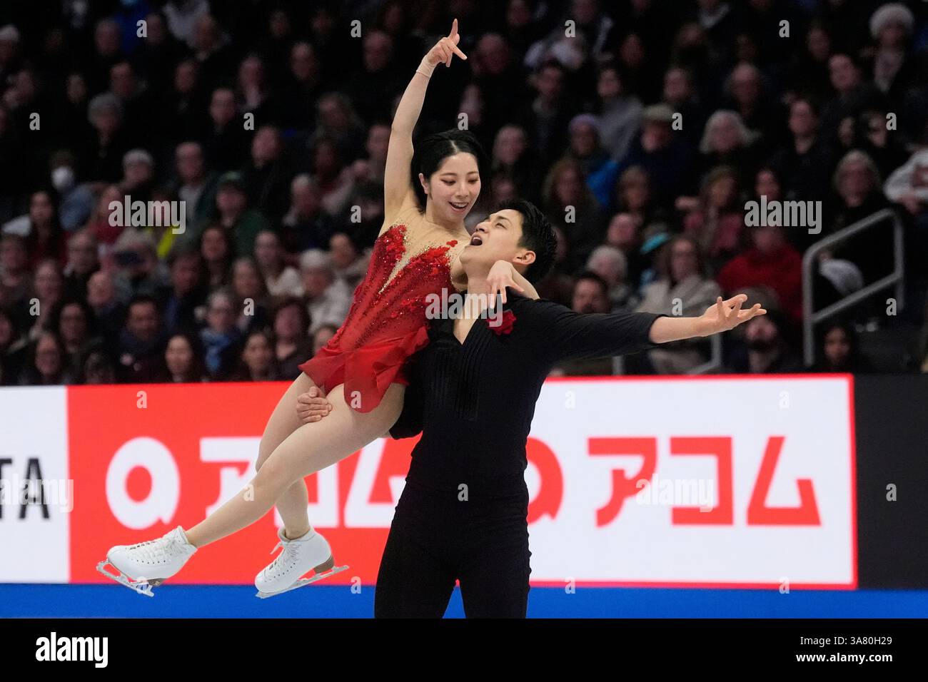 Riku Miura and Ryuichi Kihara, of Japan, perform during the pairs free ...