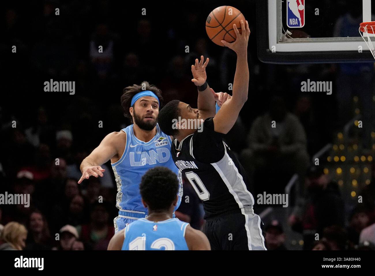 Cleveland Cavaliers guard Max Strus, left, fouls San Antonio Spurs ...