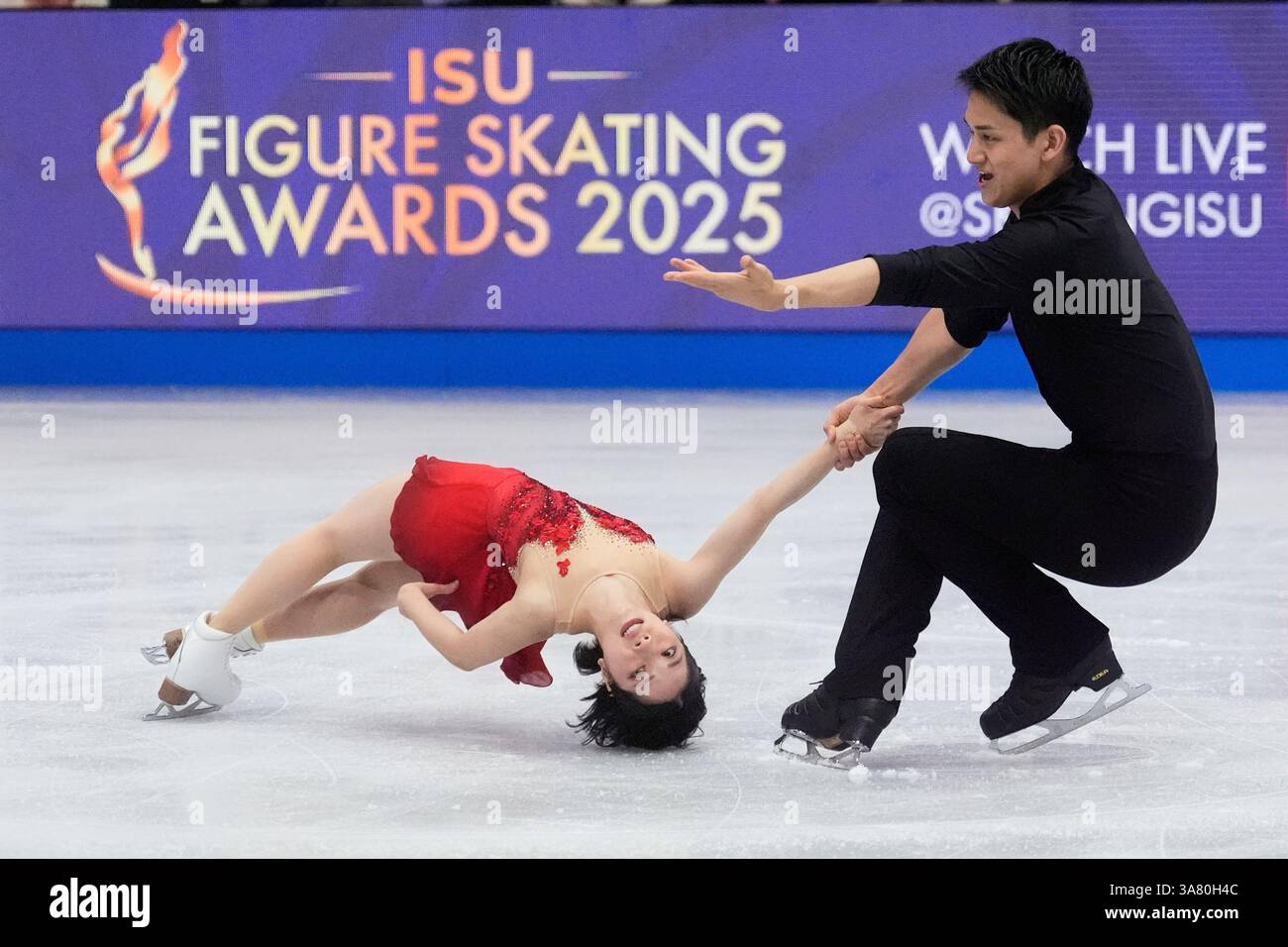 Riku Miura and Ryuichi Kihara, of Japan, perform during the pairs free ...