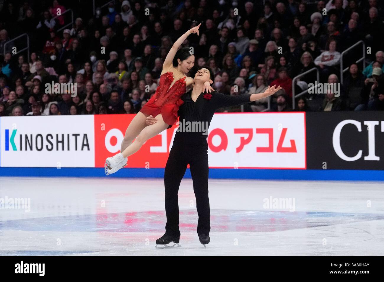 Riku Miura and Ryuichi Kihara, of Japan, perform during the pairs free ...