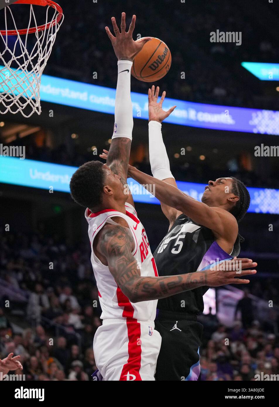 Utah Jazz forward Cody Williams (5) shoots as Houston Rockets forward ...