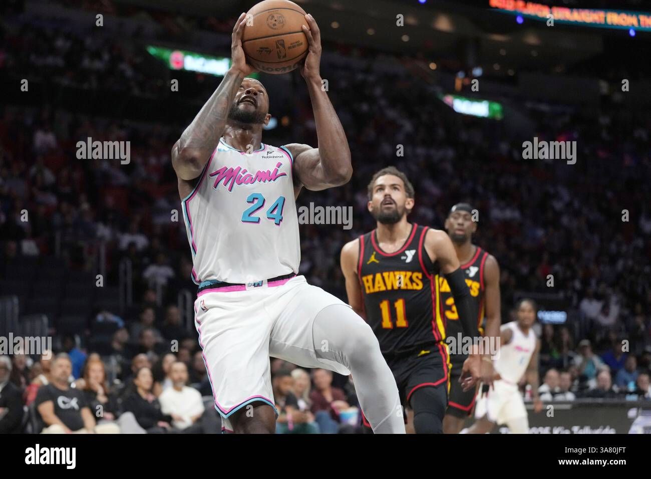 Miami Heat forward Haywood Highsmith (24) goes up for a shot past ...