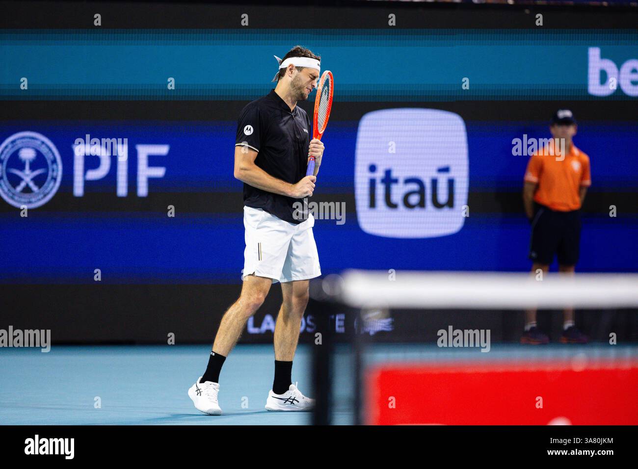 MIAMI GARDENS, FLORIDA - MARCH 27: Taylor Fritz of USA hits his head ...